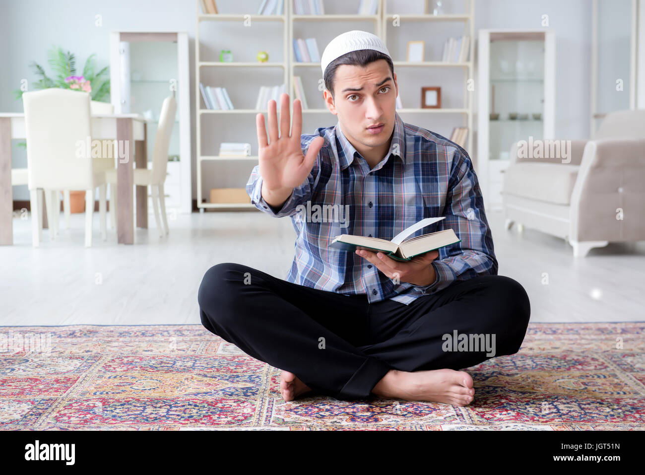 Muslim man praying at home Stock Photo - Alamy