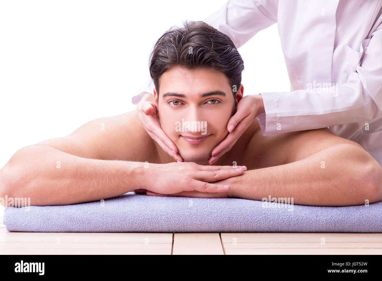 Handsome man in spa massage concept Stock Photo - Alamy