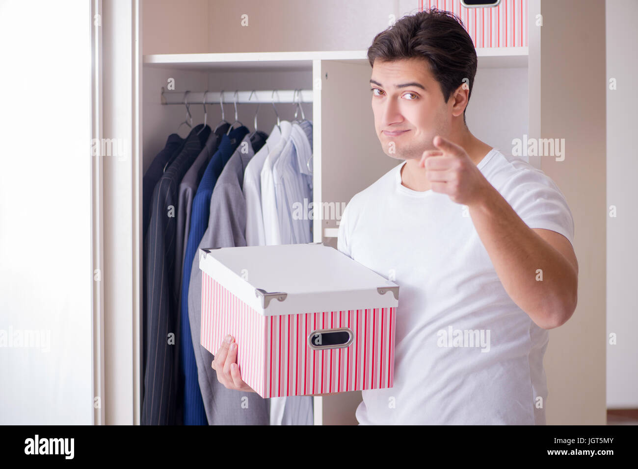 Young man businessman getting dressed for work Stock Photo - Alamy