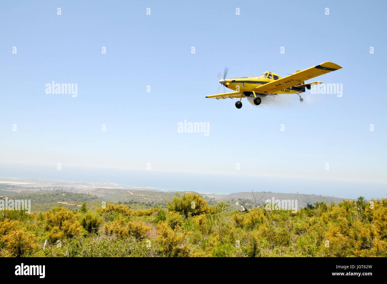firefighting Aircraft dropping fire retardant on a fire during a ...
