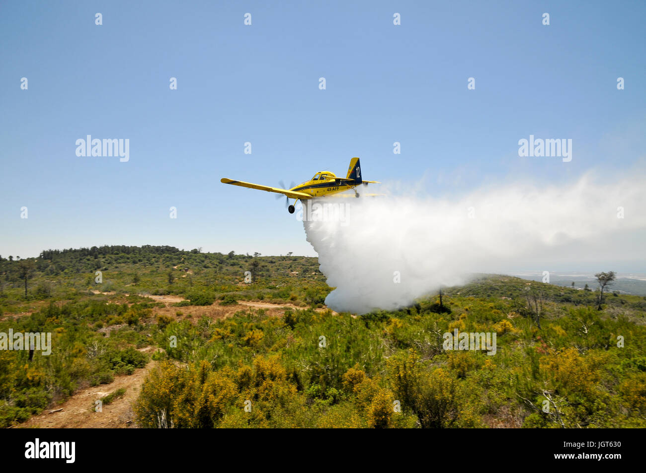 firefighting Aircraft dropping fire retardant on a fire during a ...