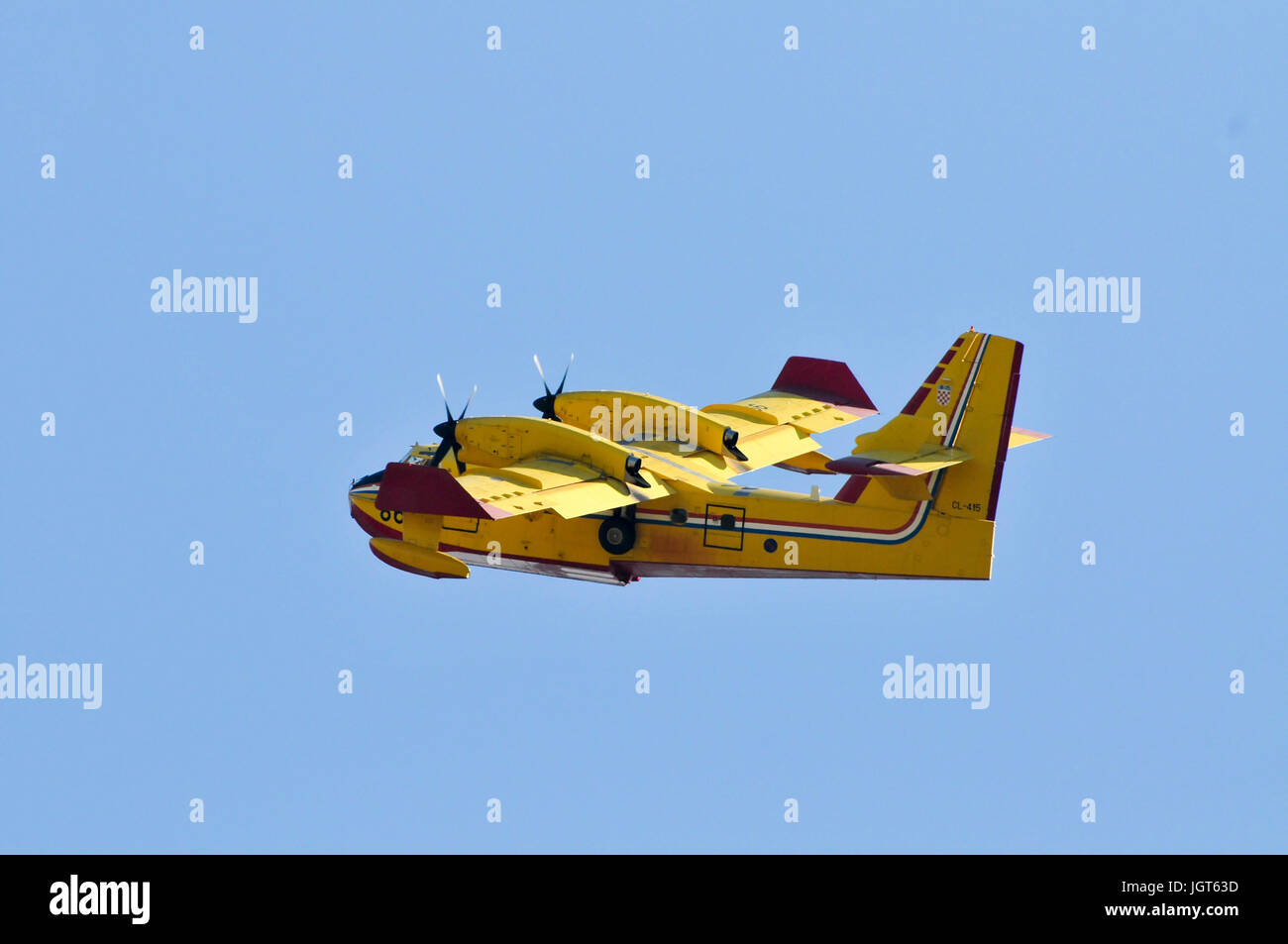 firefighting Aircraft dropping fire retardant on a fire during a ...