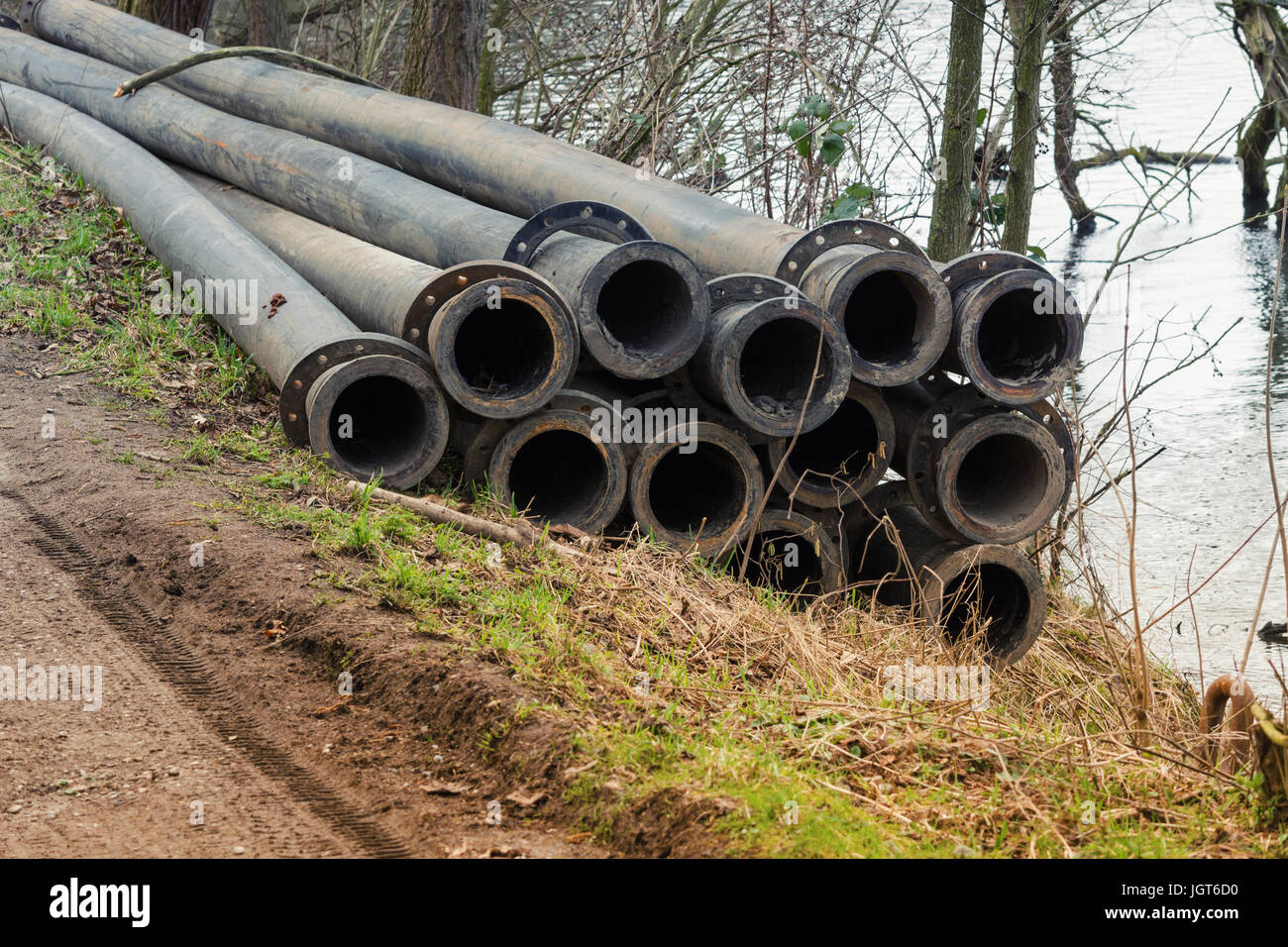 Pipeline, plastic pipes float on the water surface Stock Photo - Alamy