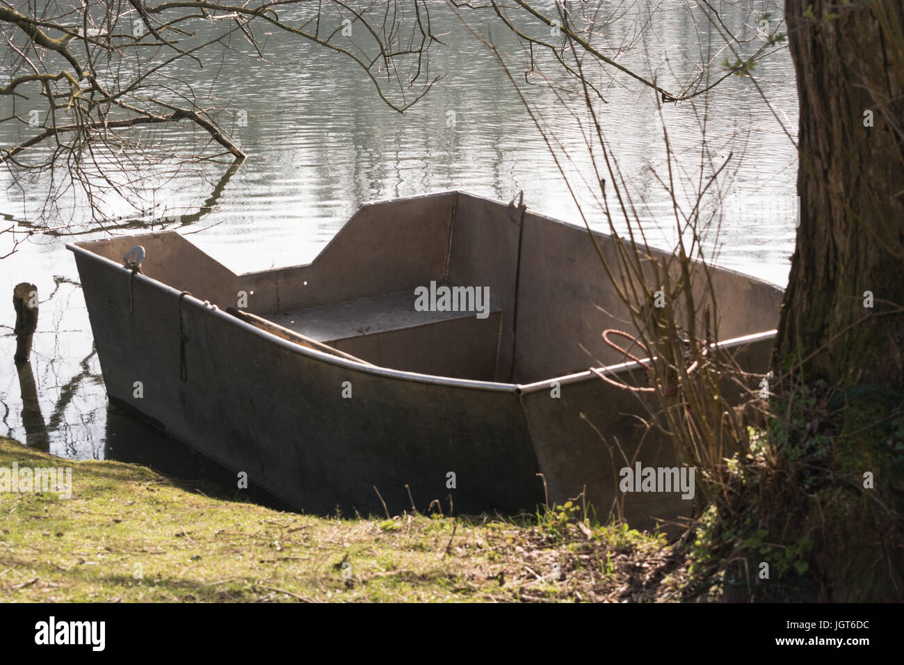Fishing boat, aluminum rowing boat on a lake Stock Photo - Alamy