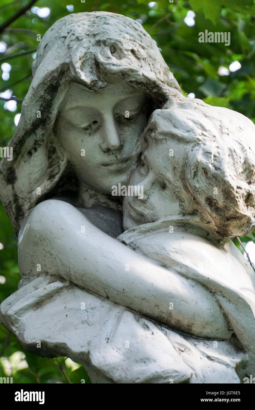 Grieving young mother with child statue Novodevichy Cemetery, Moscow ...