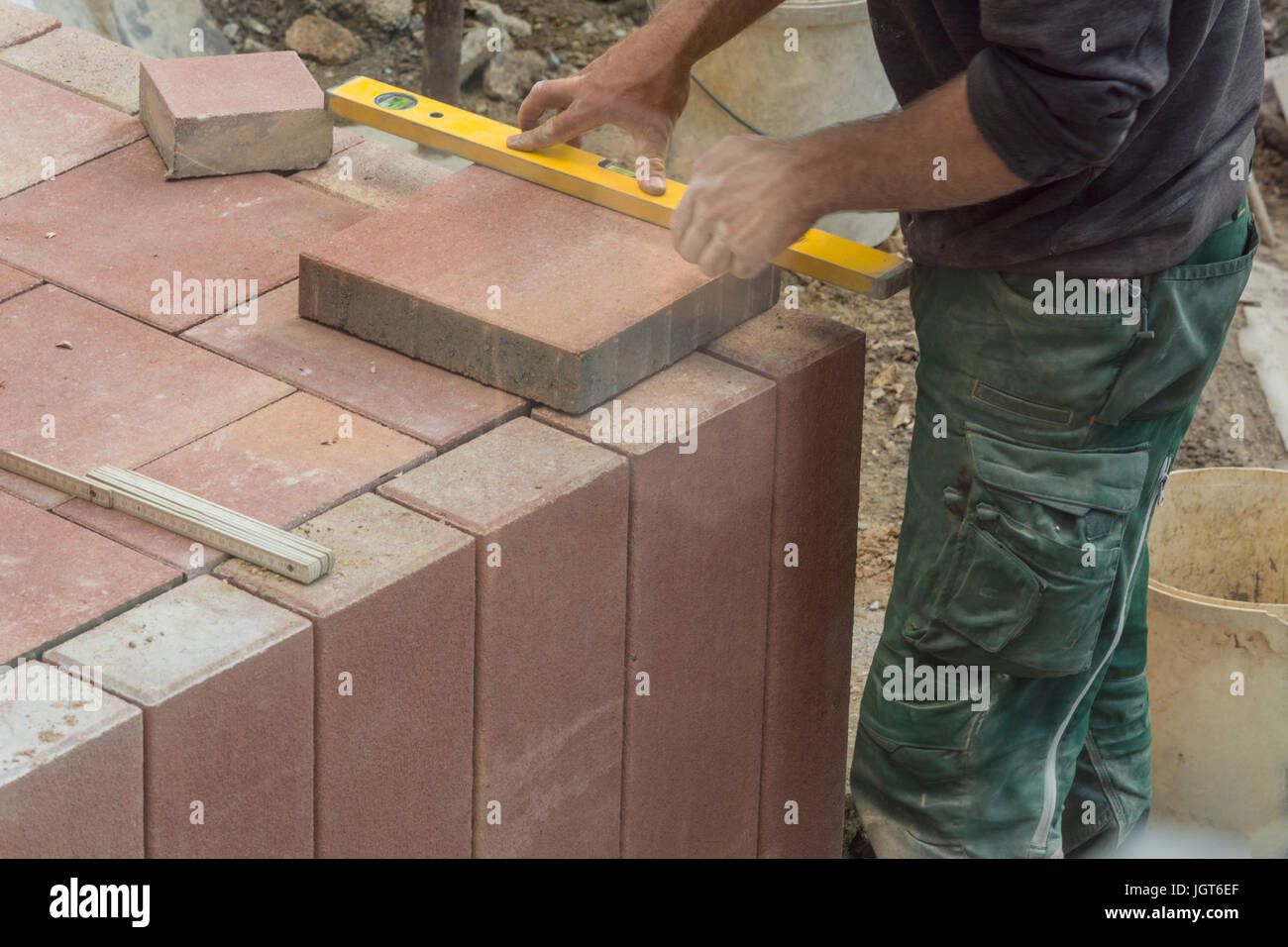 Man cutting stone slabs, concrete slab with an electric grinder Stock ...