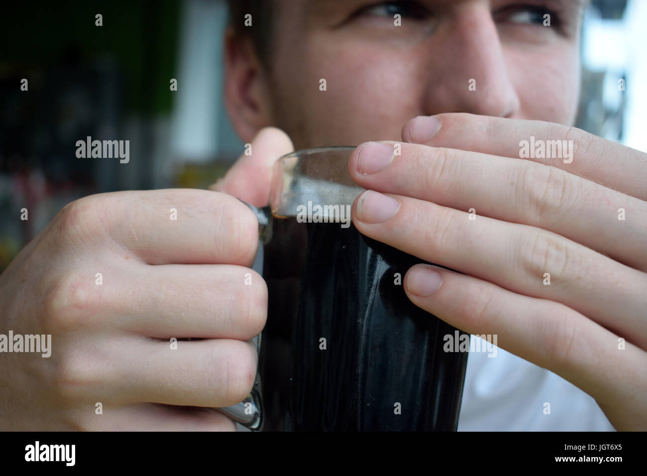 Man drinking coffee Stock Photo - Alamy