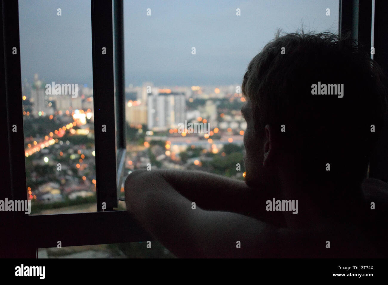 Man looking out the window Stock Photo - Alamy