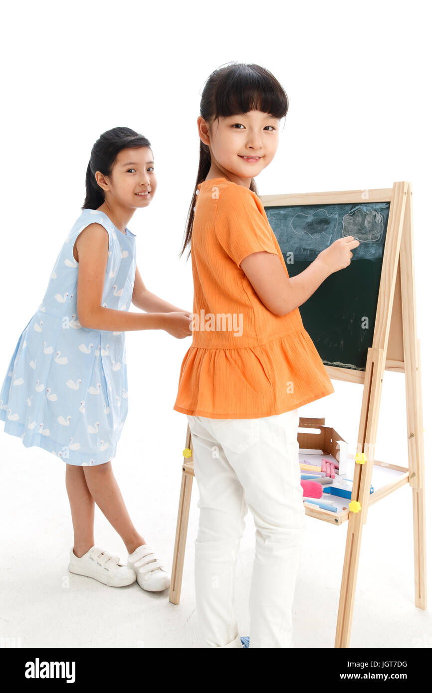 Two school girls with drawing board Stock Photo - Alamy