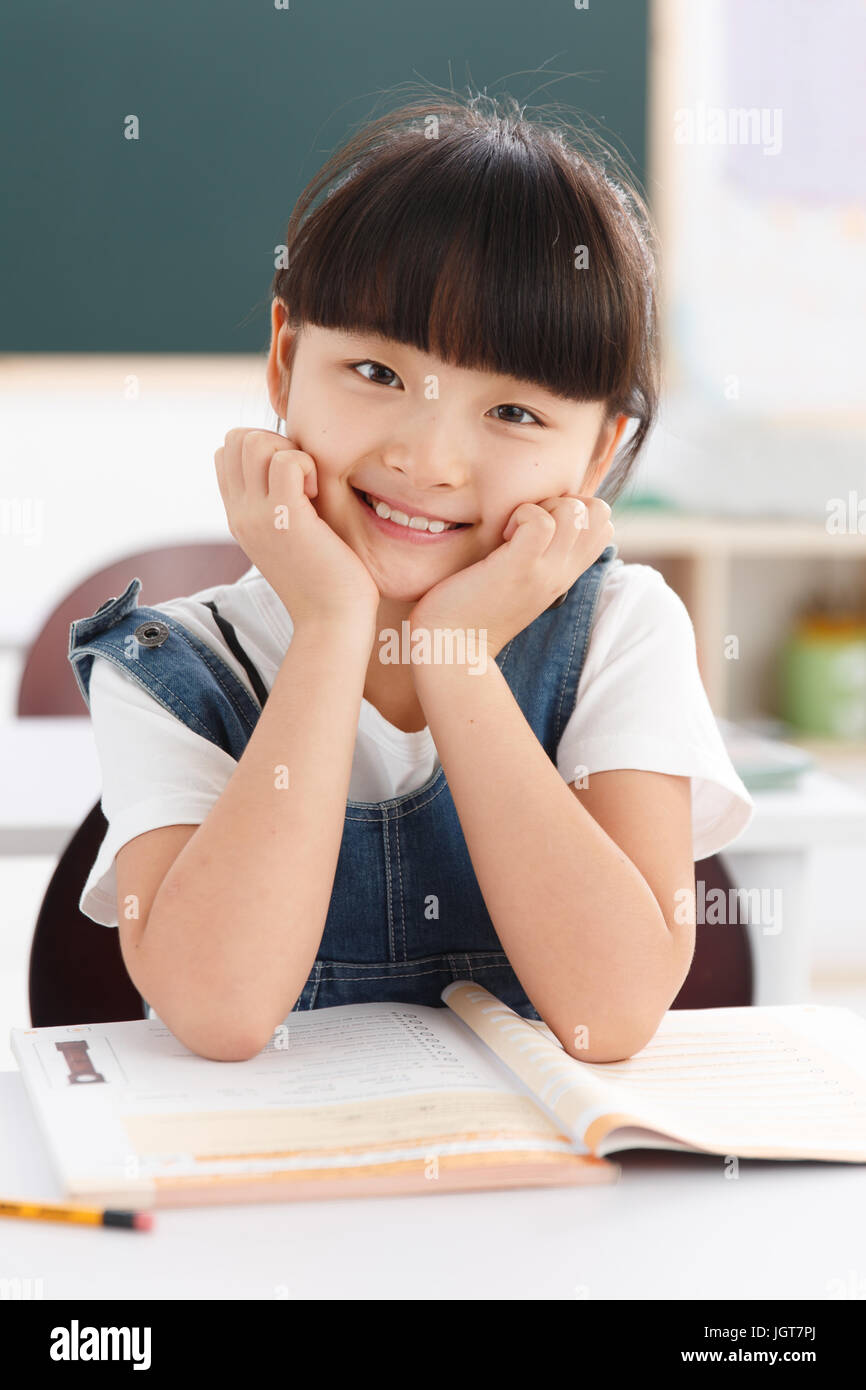 Primary school girls in the classroom Stock Photo - Alamy