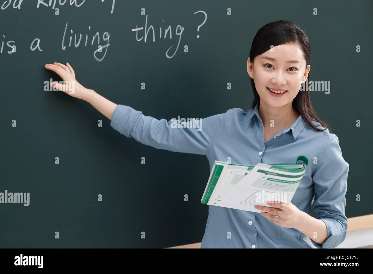 Teacher teaching in classroom Stock Photo - Alamy