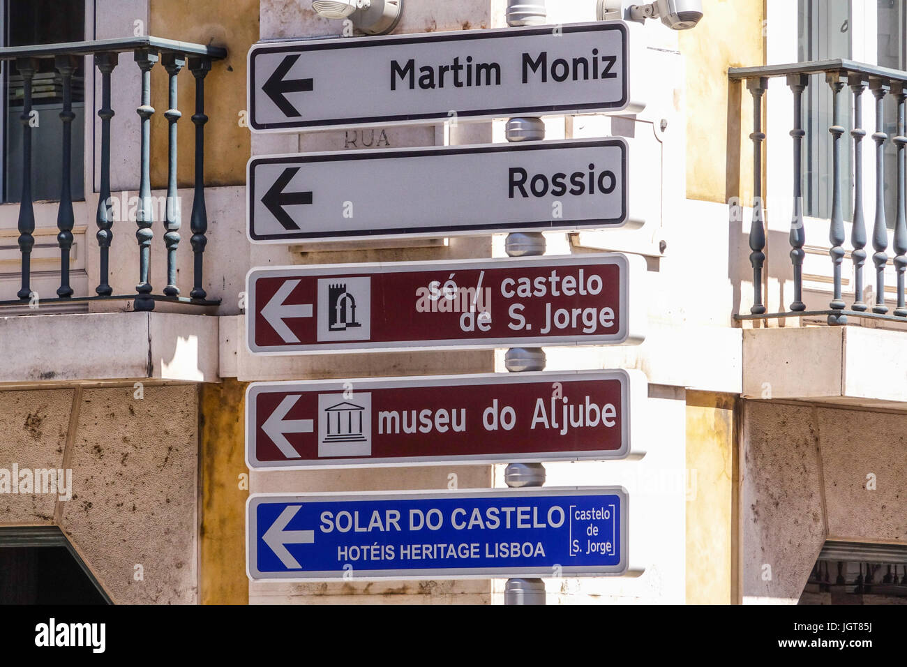 Direction signs in the street of Lisbon Stock Photo - Alamy