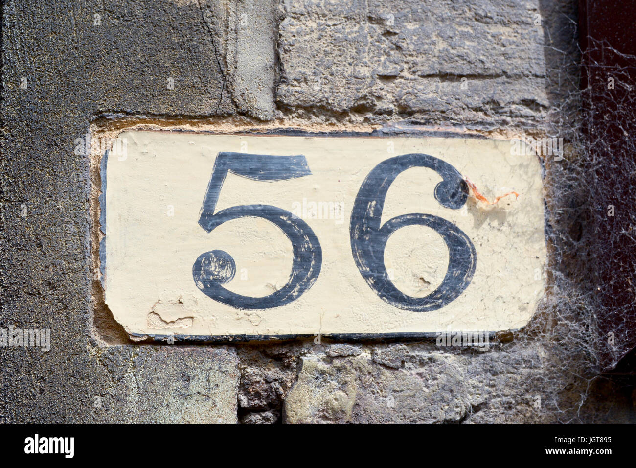 House number 56 painted sign Stock Photo - Alamy