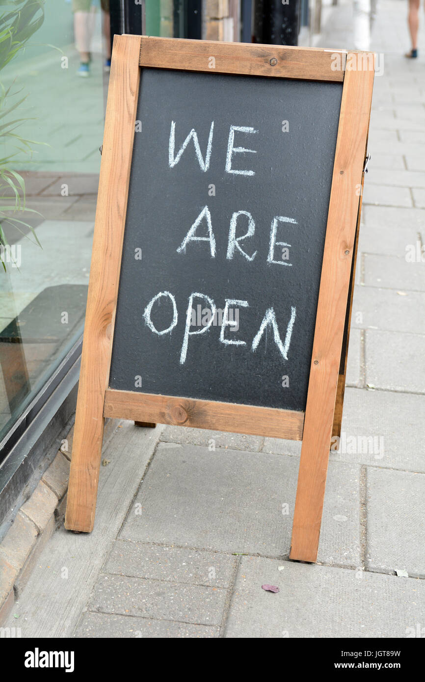 We are open chalkboard sign outside shop hi-res stock photography and ...