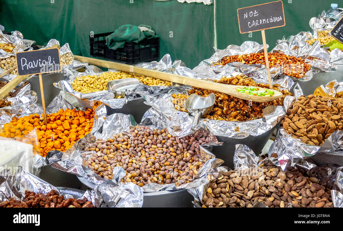 Big choice of nuts and fruits on a market for Portuguese specialties in ...