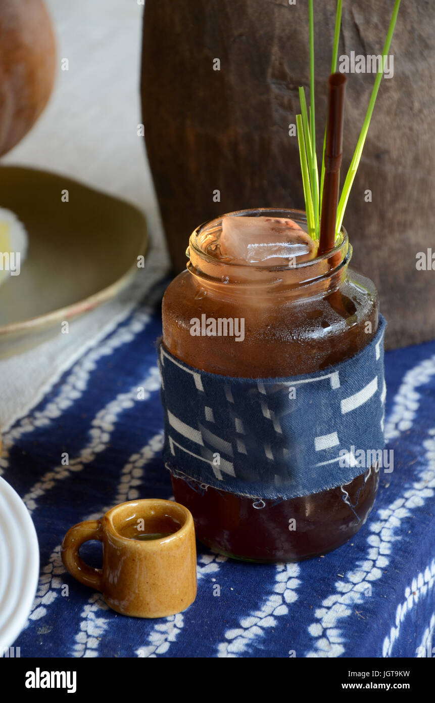 Rice berry ice tea on wood table Stock Photo - Alamy