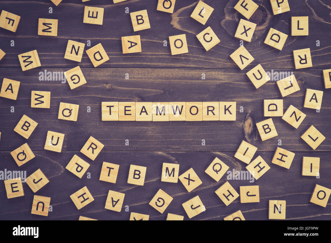 Teamwork word wood block on table for business concept Stock Photo - Alamy