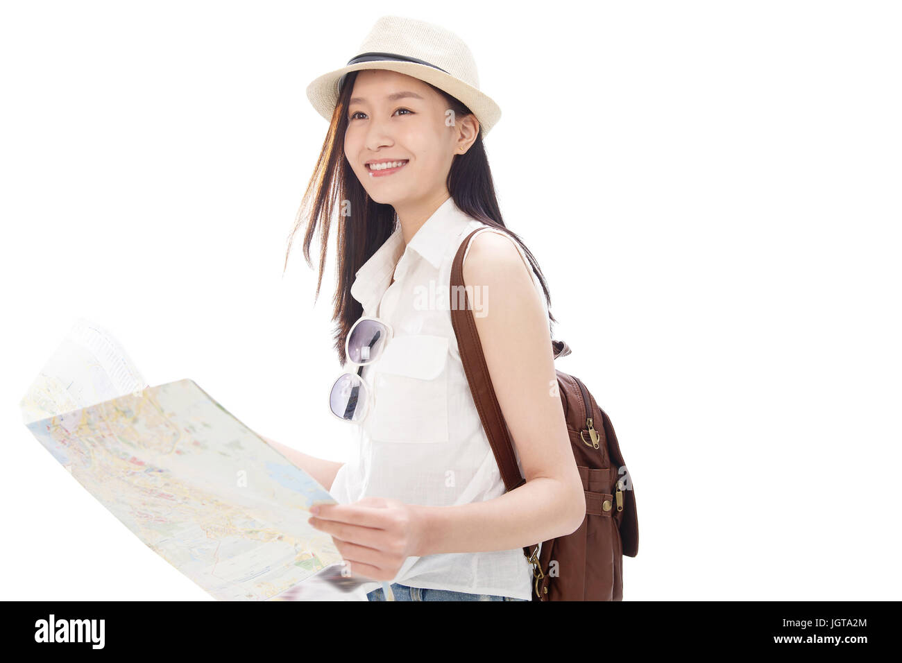 Young woman on travel checking map Stock Photo - Alamy
