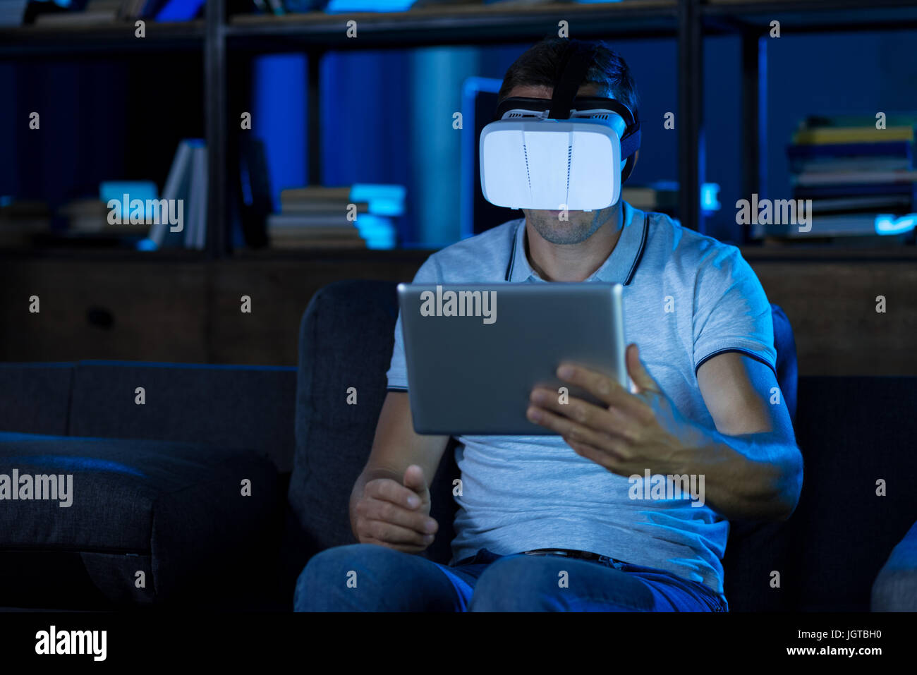 Energetic inspired man using devices for games Stock Photo - Alamy