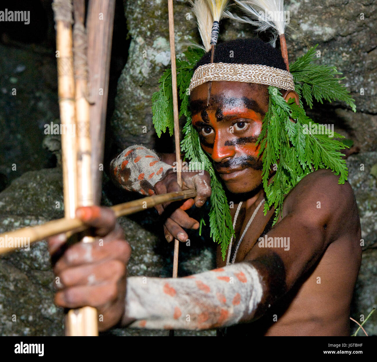 NEW GUINEA, INDONESIA - 13 JANUARY: Warriors tribe Yaffi in war paint ...