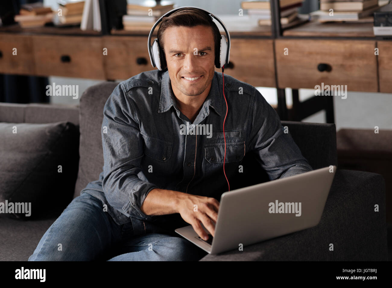 Positive handsome man enjoying his working experience Stock Photo - Alamy