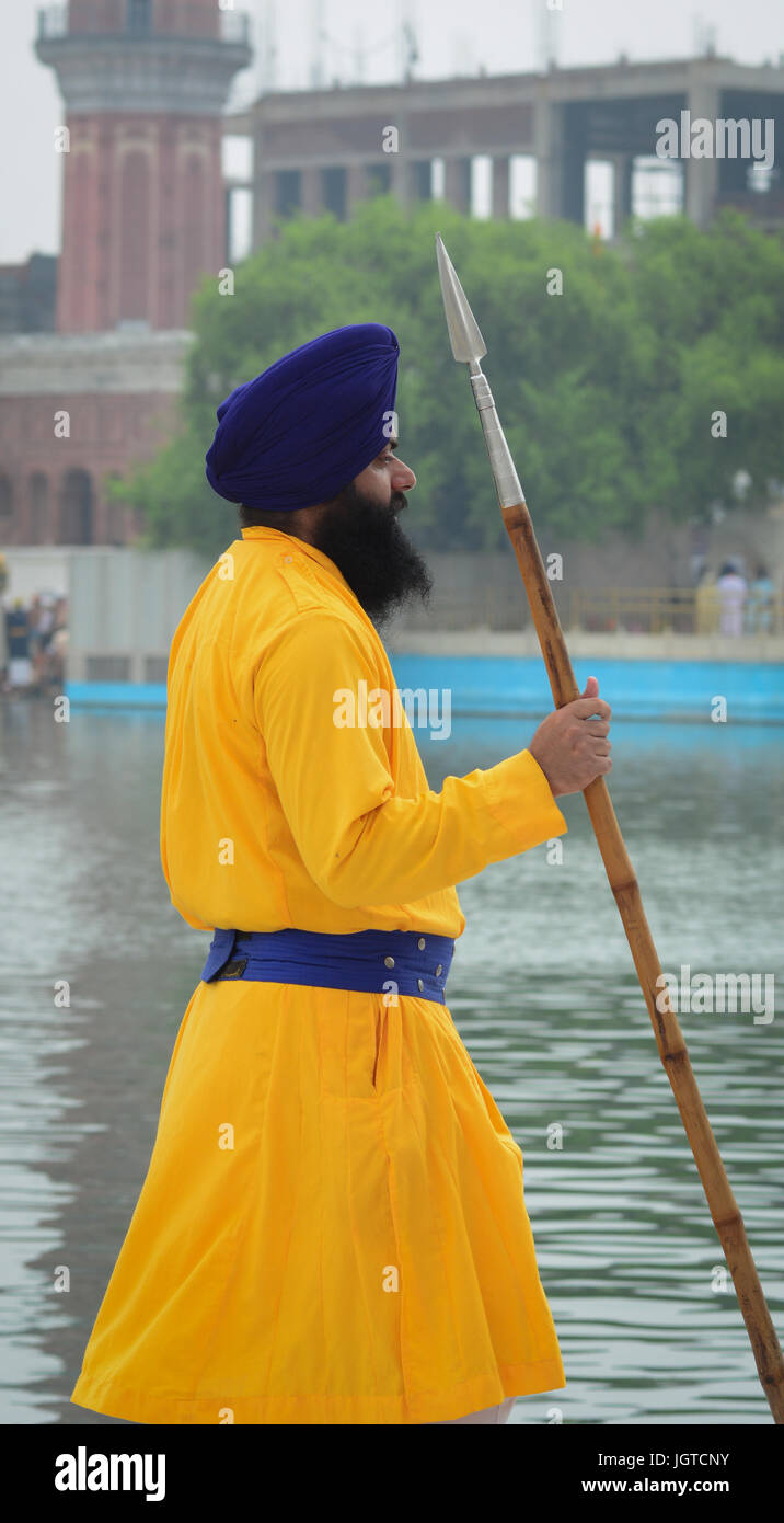 Amritsar, India - Jul 25, 2015. Portrait of Sikh guard with a spearhead ...