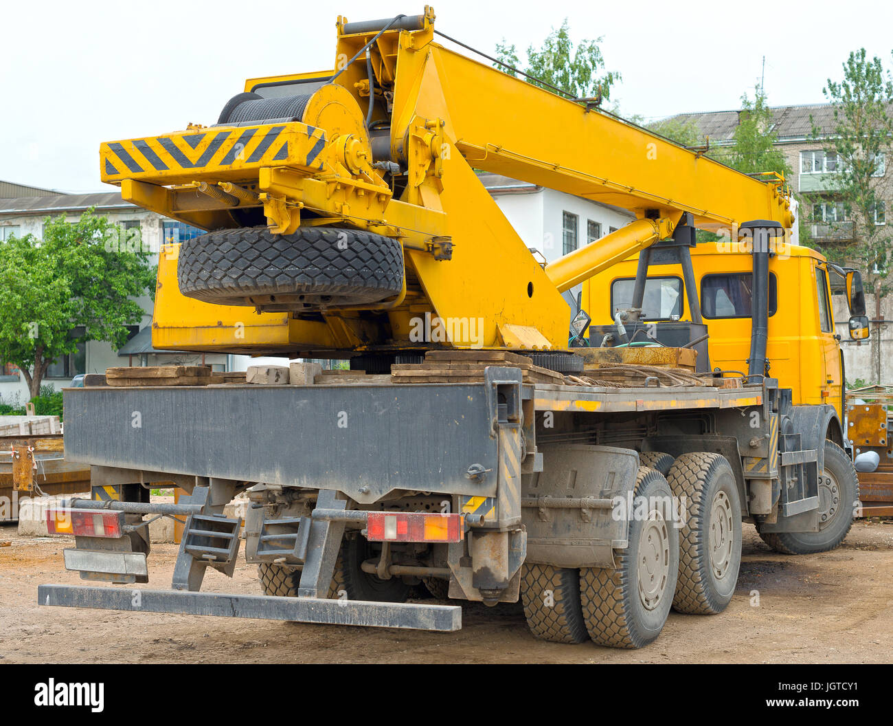 Crane truck on construction site Stock Photo - Alamy
