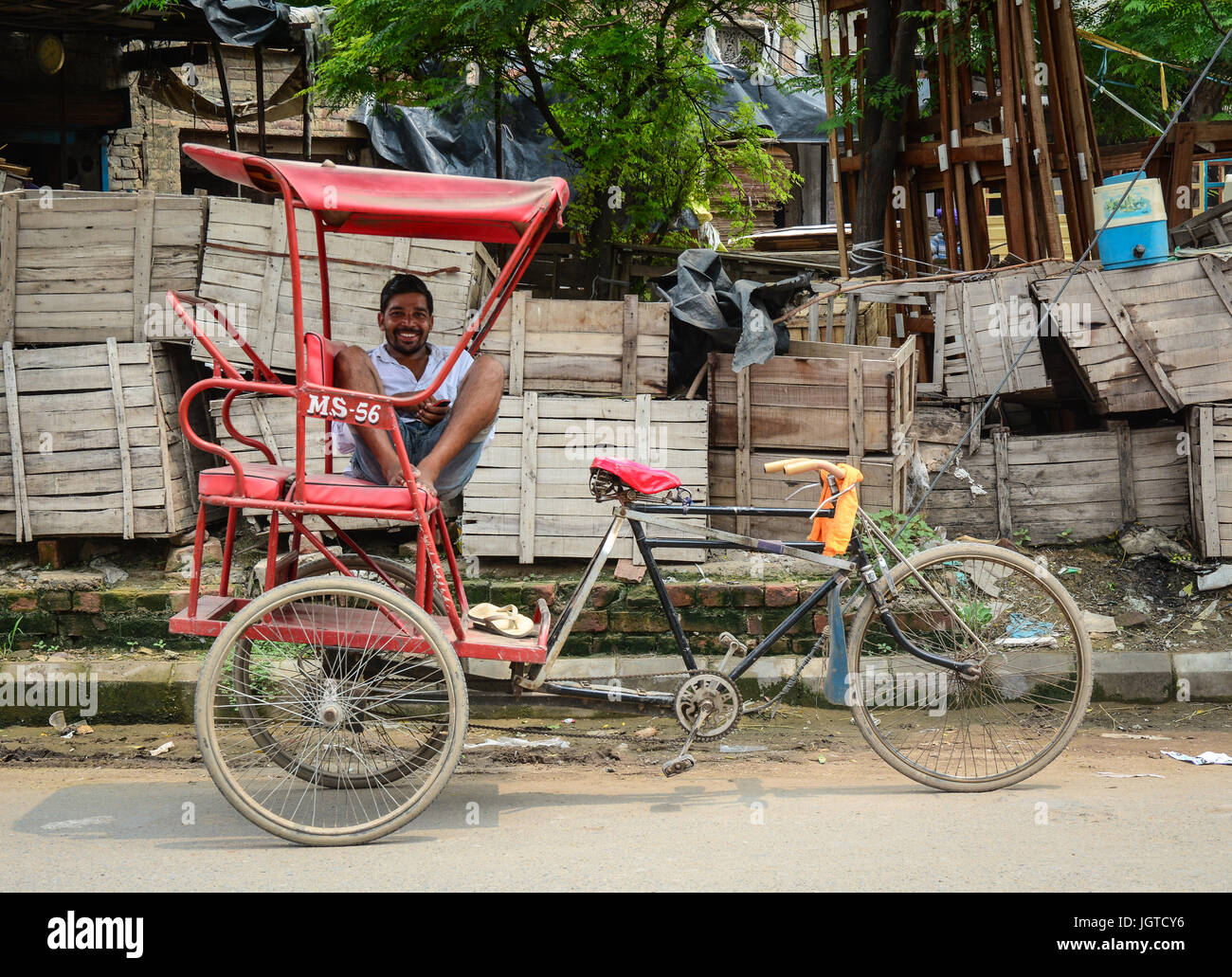 Amritsar, India - Jul 25, 2015. A man with rickshaw waiting for ...