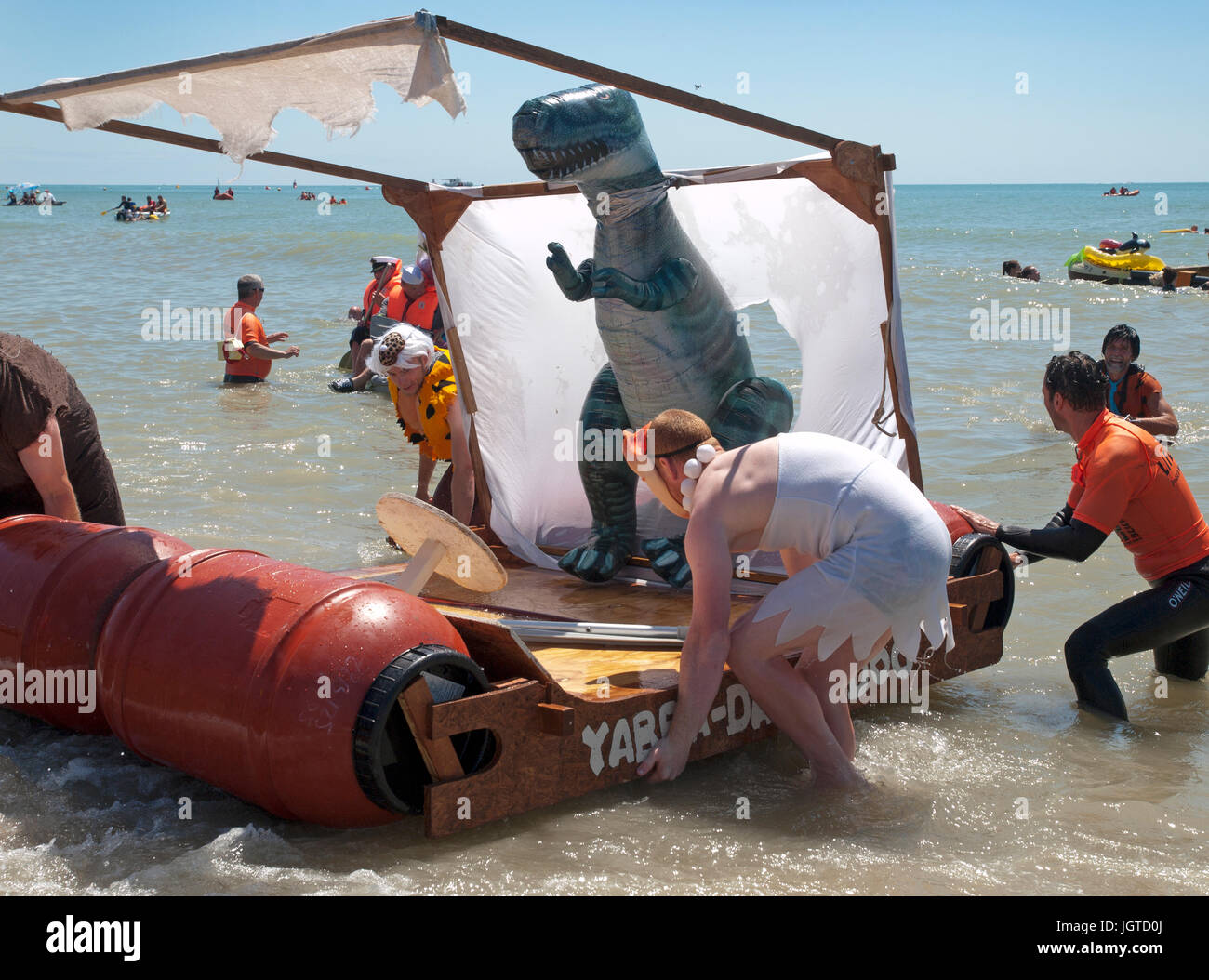 A Flintstones themed raft sets off in the Paddle Around The Pier event ...