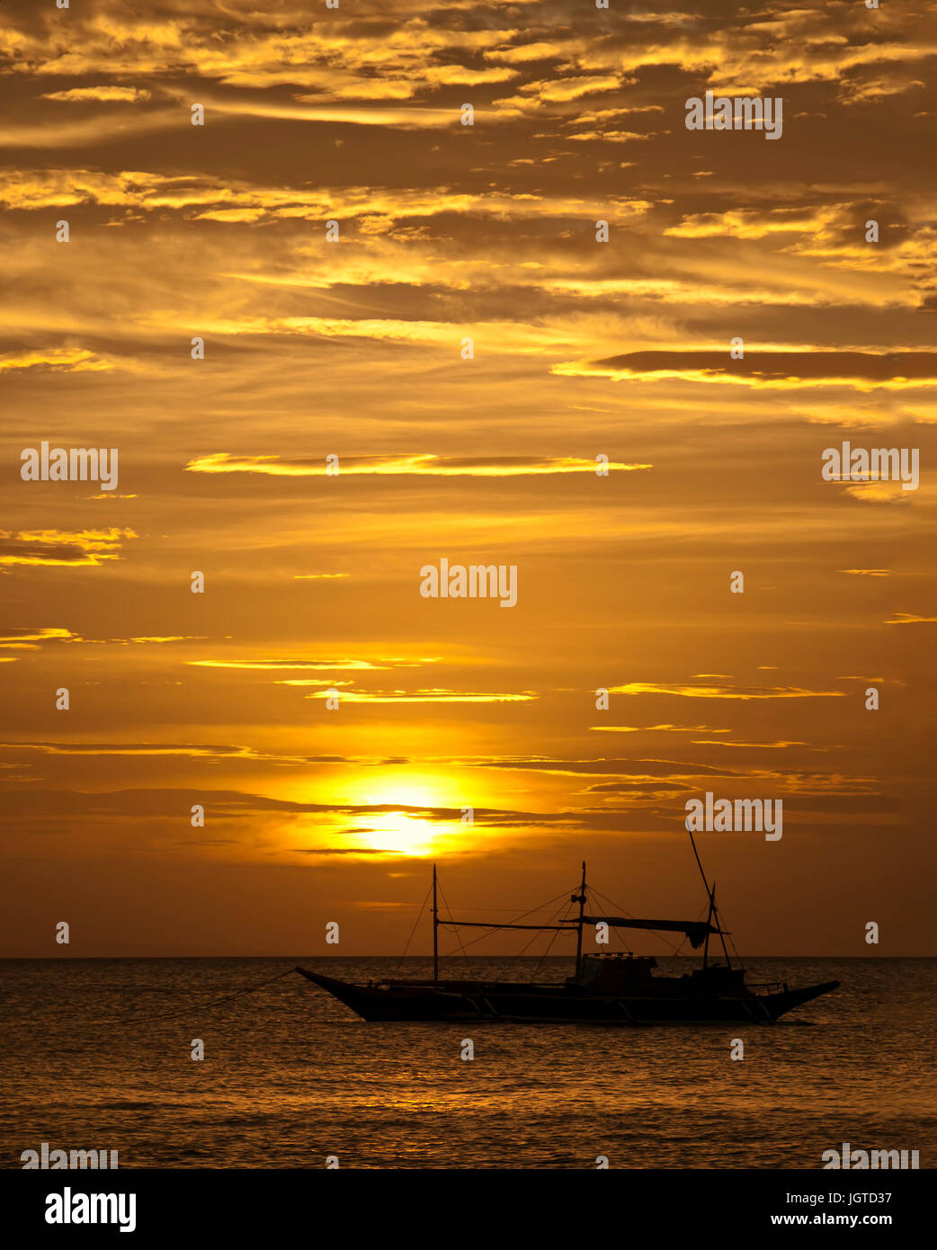 filipino fishing boat in the sunset on Boracay island Stock Photo - Alamy