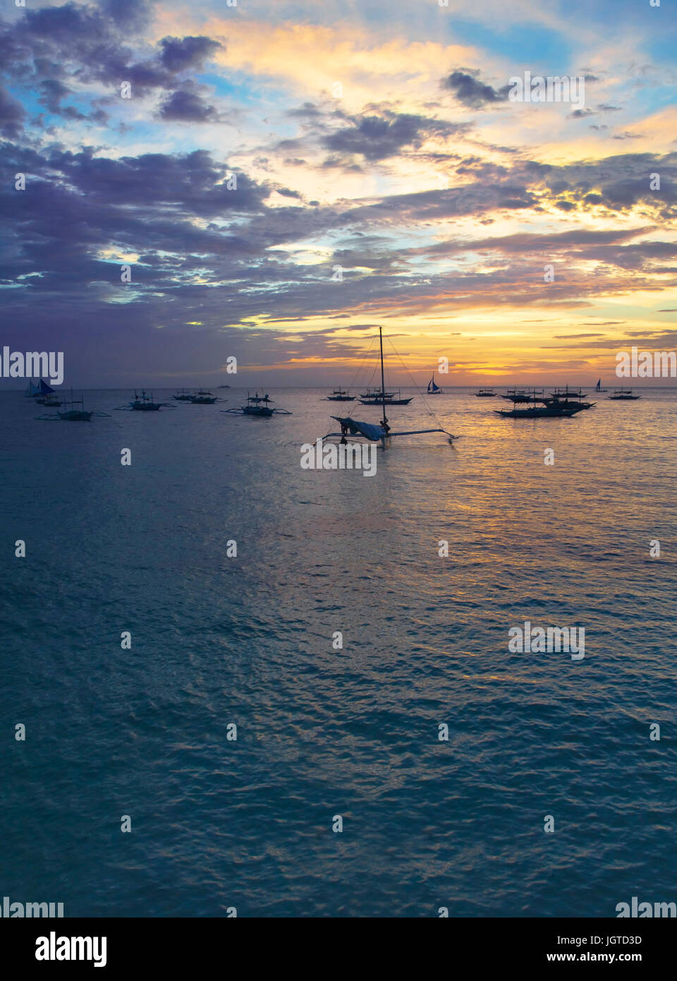fishing boats in the sunset in the harbour Stock Photo - Alamy