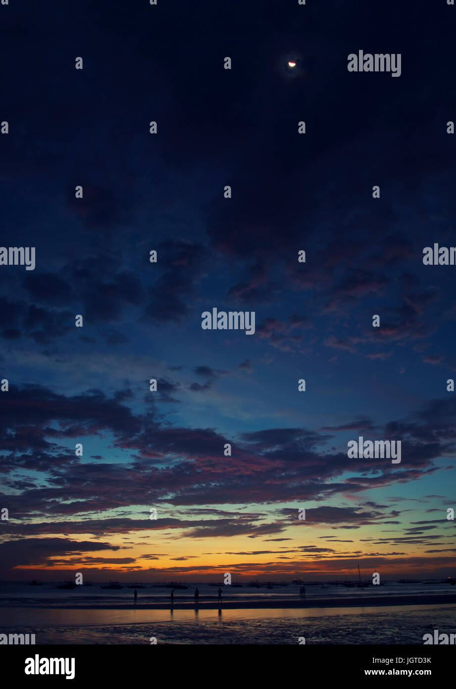 people and boats on the beach under the moonlight Stock Photo - Alamy