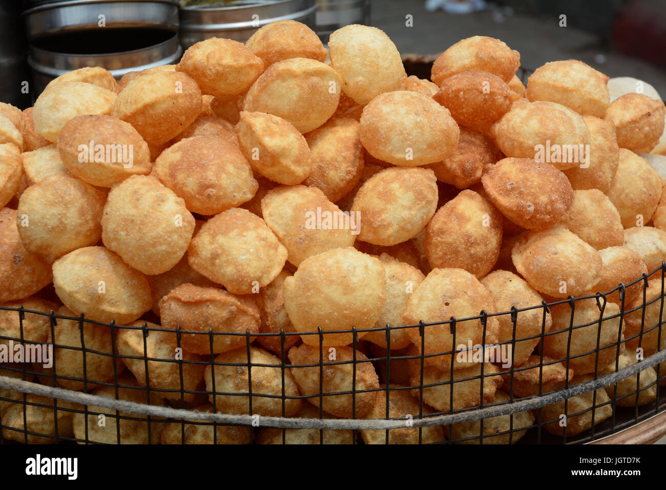 Fried cakes with curry - Indian street food at the market. Close up ...