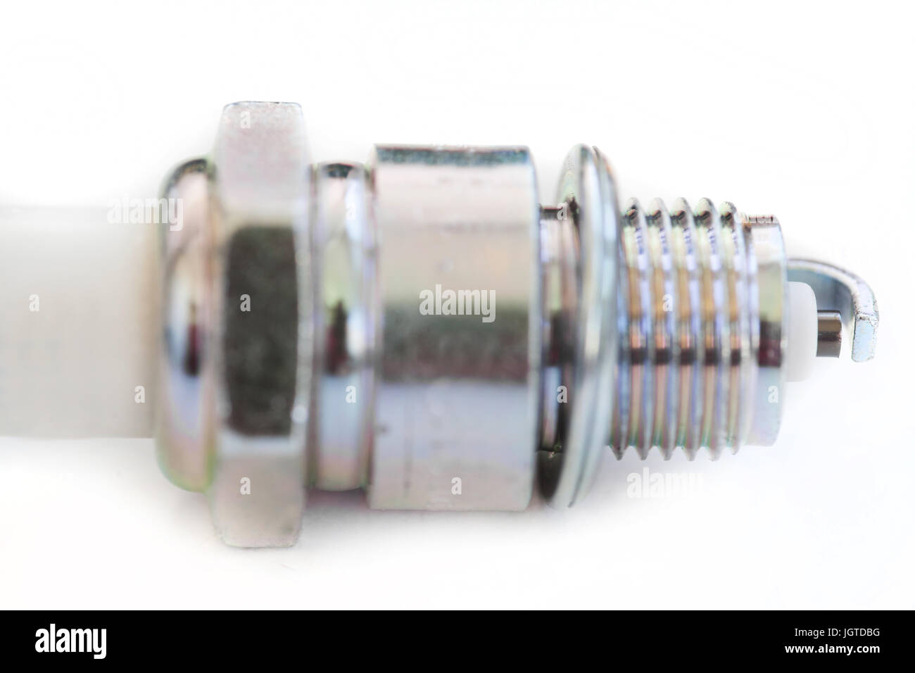 Close up shot of a new spark plug on white Stock Photo - Alamy