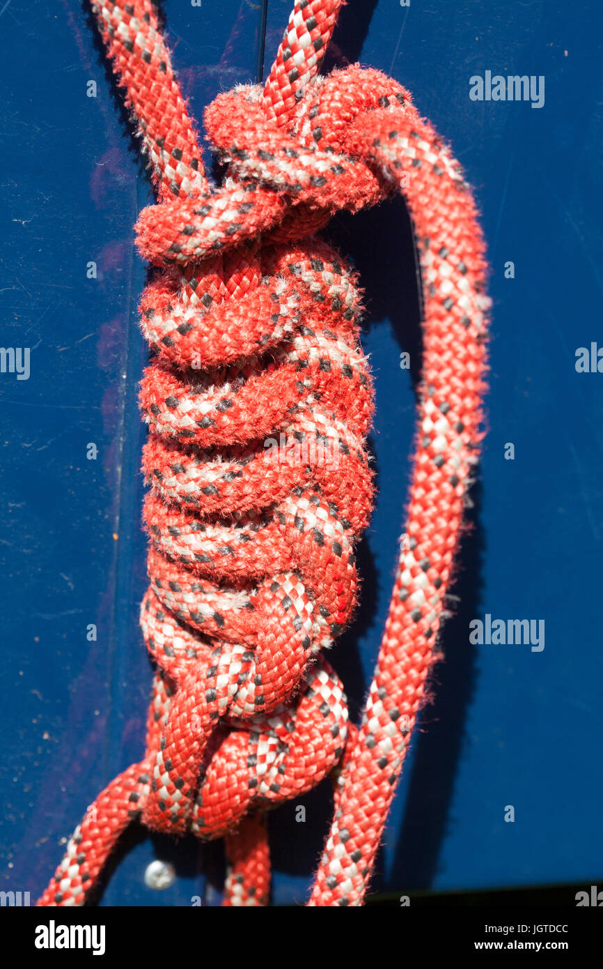 red and white colored rope with knot Stock Photo - Alamy