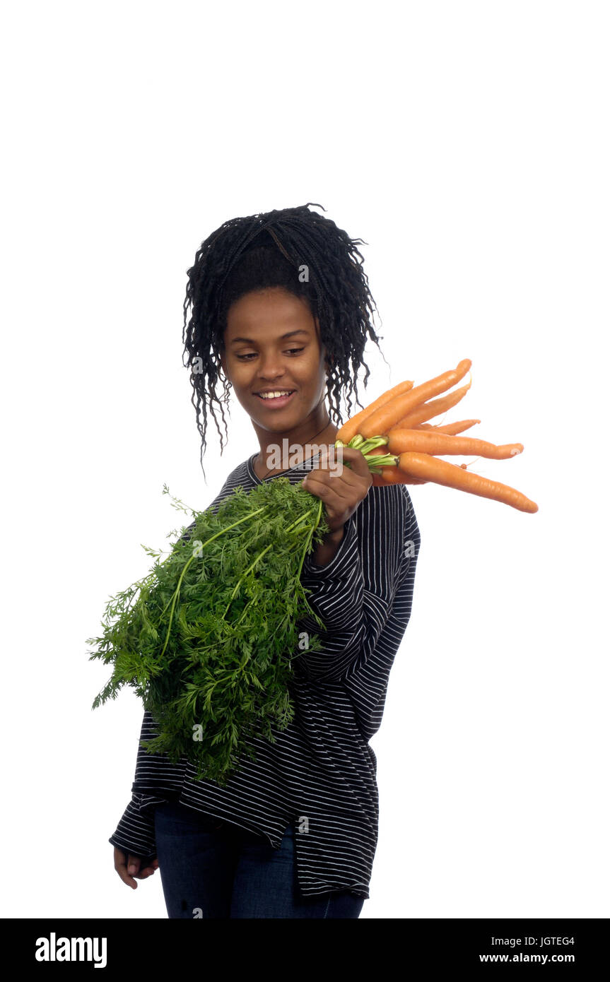 Teenage girl with a carrot Stock Photo - Alamy