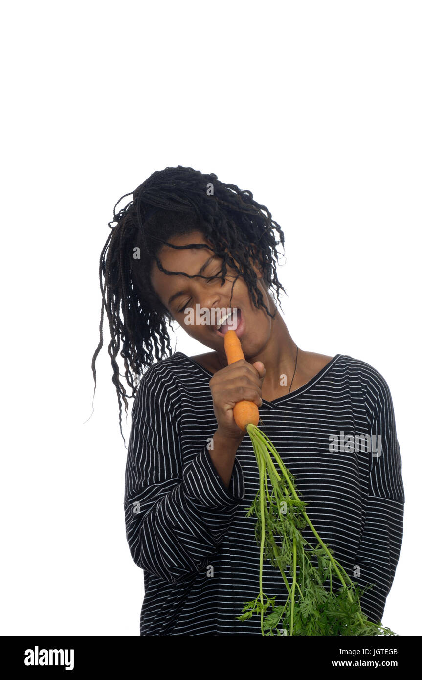 Teenager girl eating carrot hi-res stock photography and images - Alamy