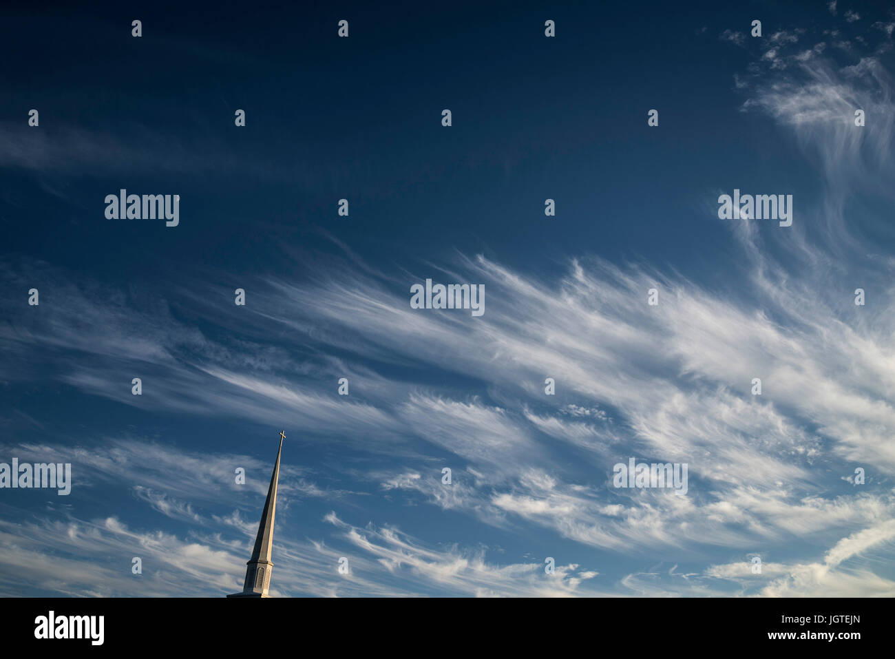 Church steeple with wispy cloud formations as a background Stock Photo ...