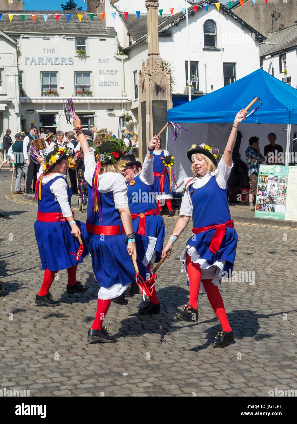 Traditional Women Morris dancers performing in Ulverston Market Place ...