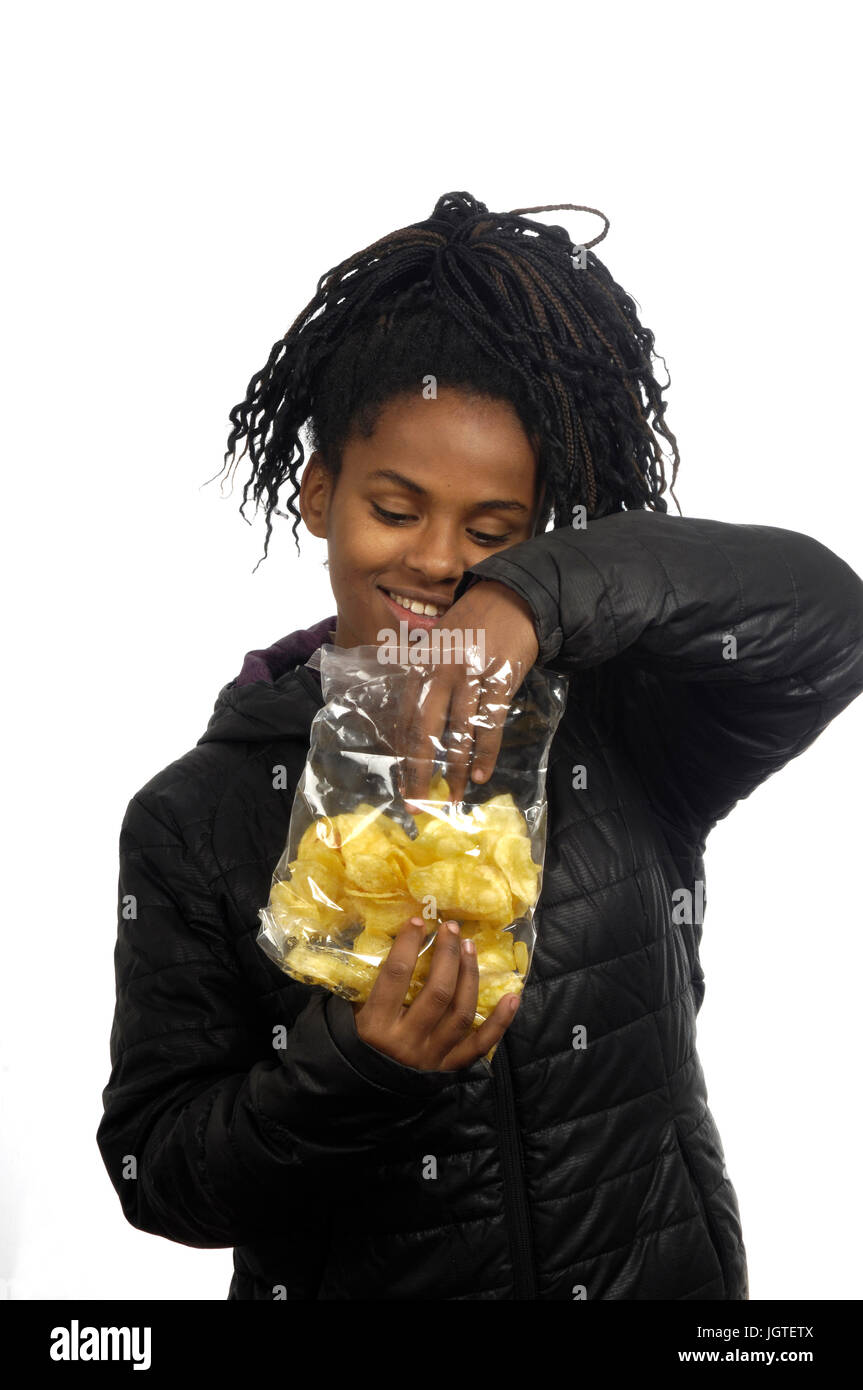 teenage girl eating chips Stock Photo - Alamy