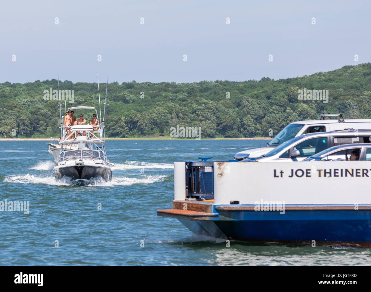 motor boat and ferry in close proximity near shelter island, ny Stock ...