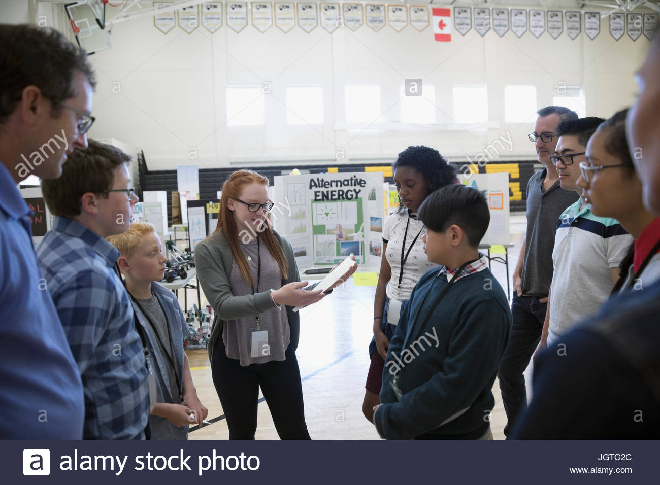 Girl middle school student presenting science project at science fair ...