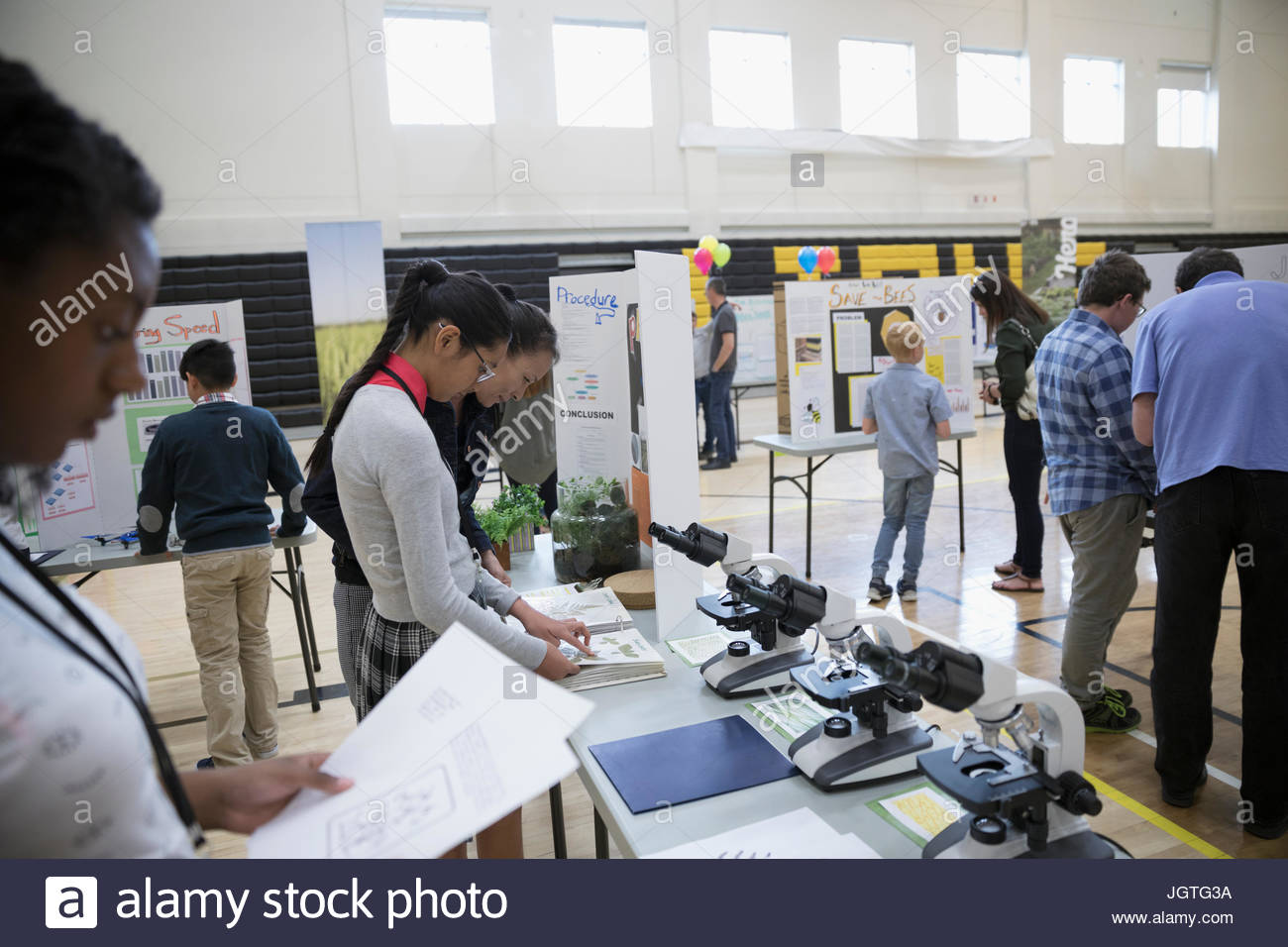 Middle school students and parents viewing science projects at science ...
