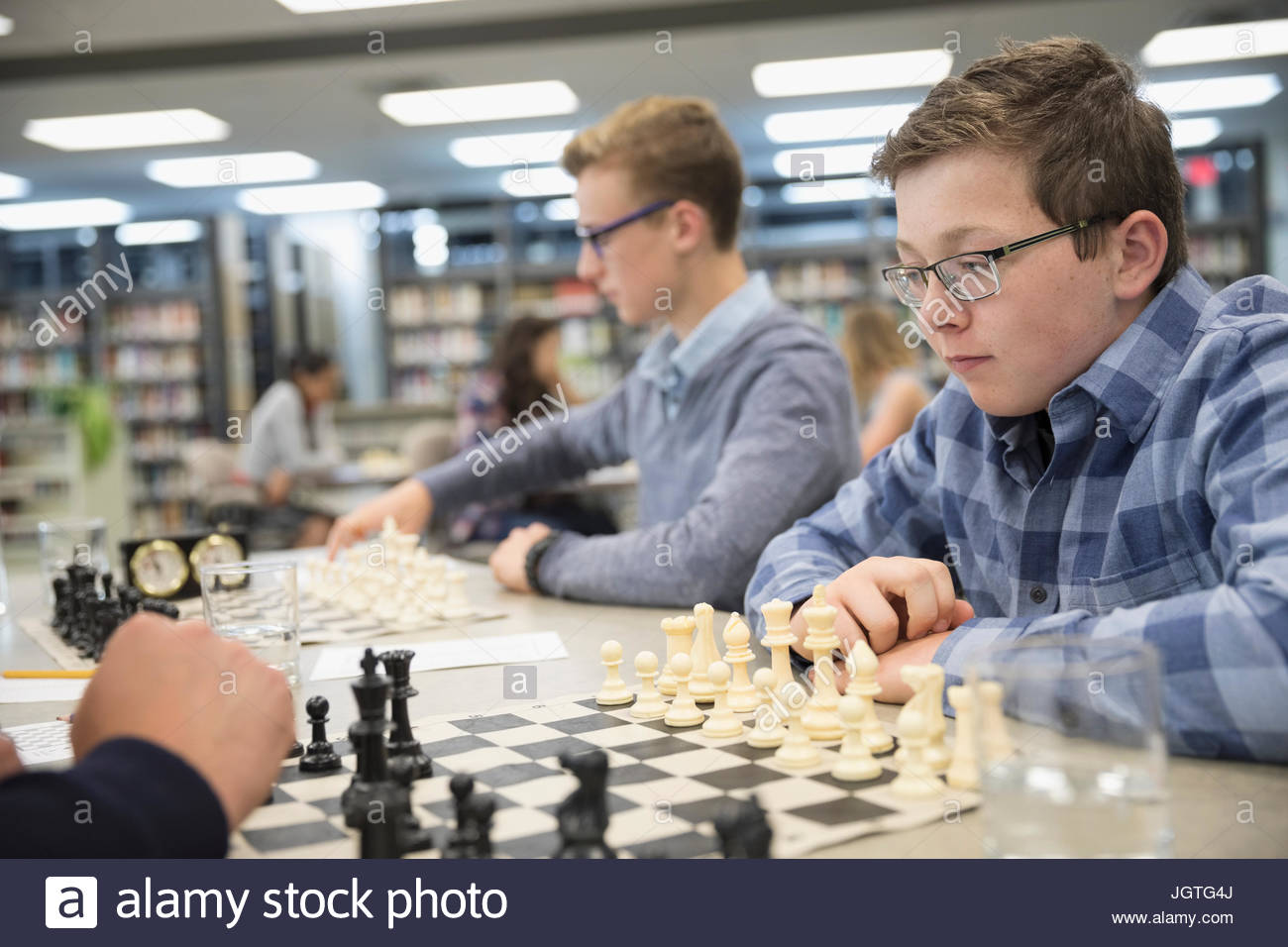 Boy learning chess piece knowledge and strategy hi-res stock ...