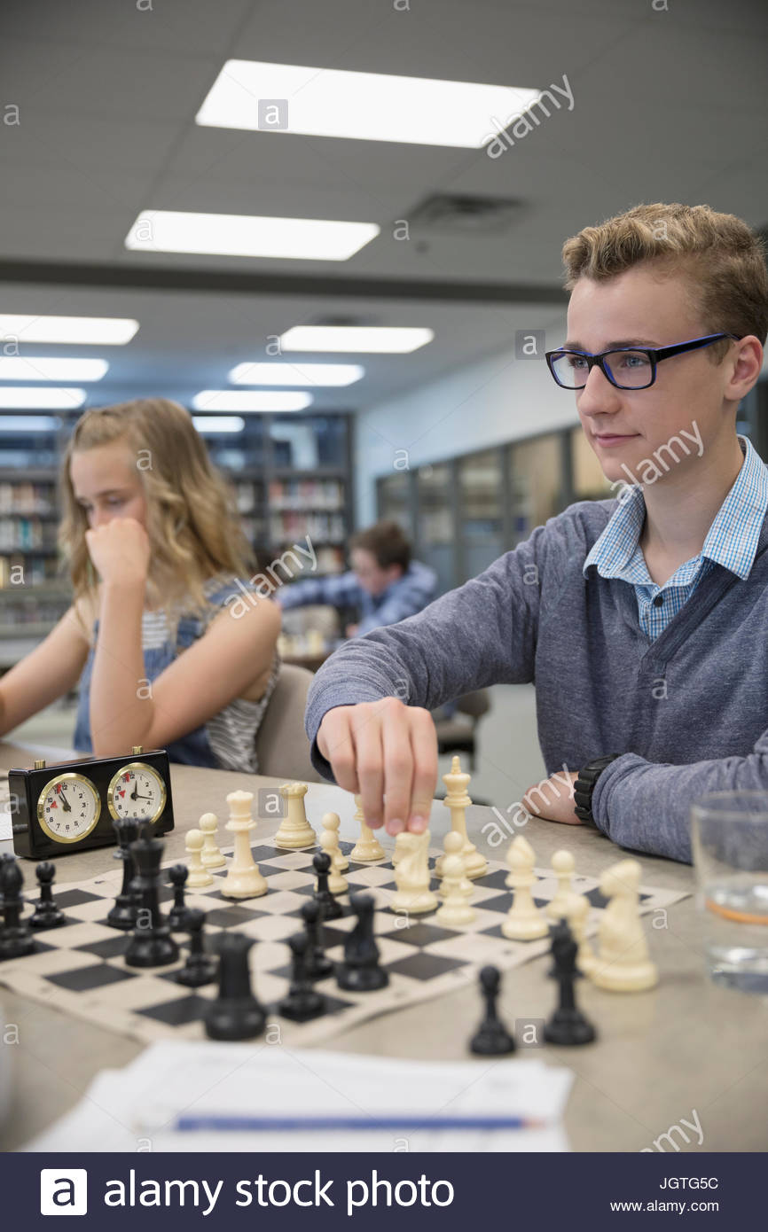 Boy learning chess piece knowledge and strategy hi-res stock ...