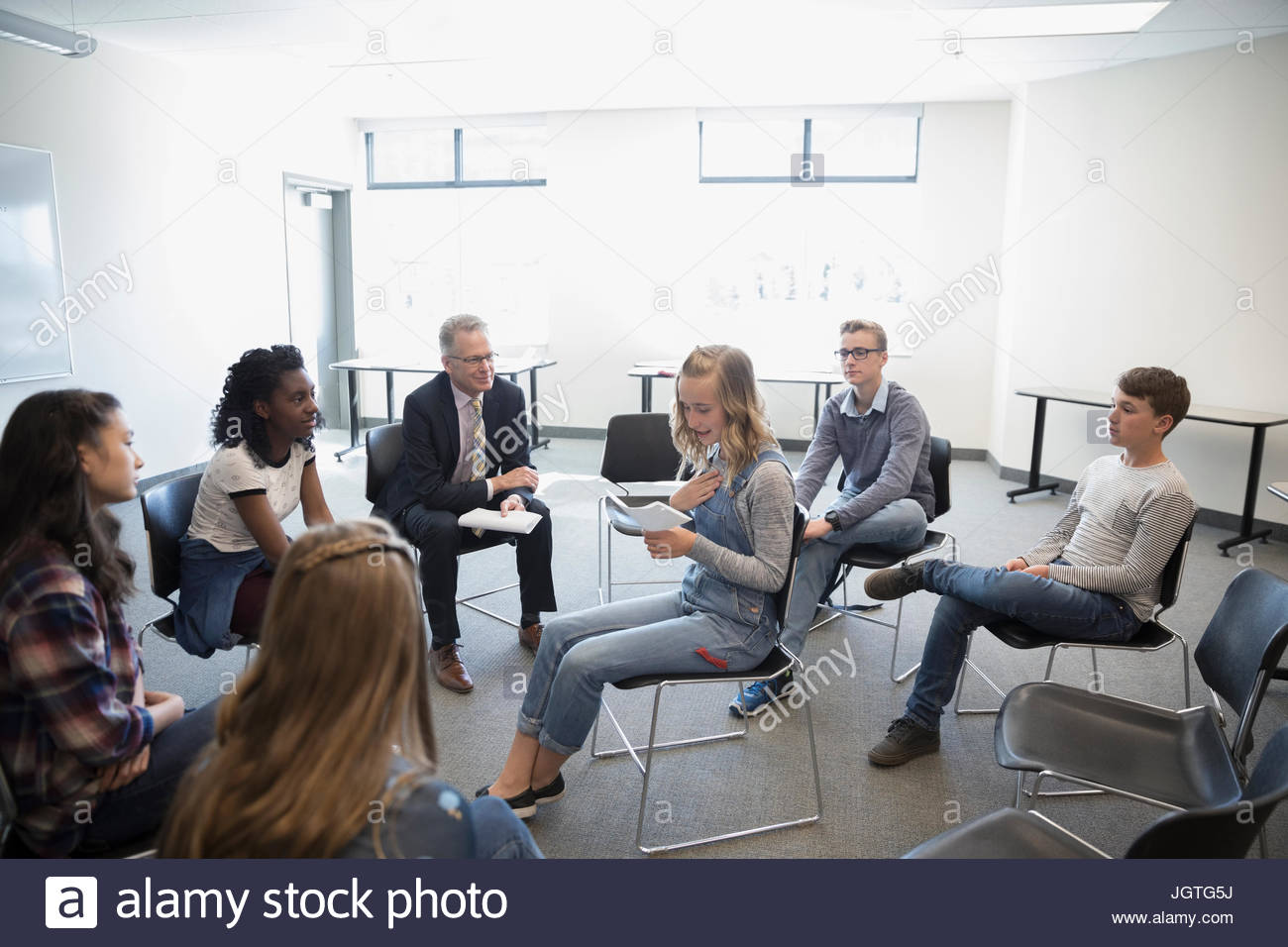Girl middle school student speaking in debate club classroom Stock ...