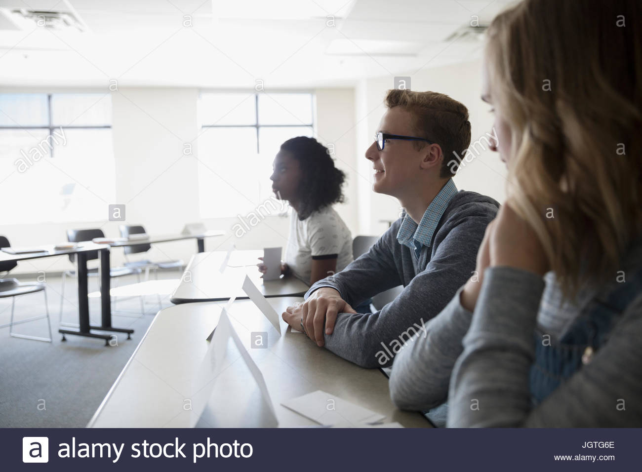 Students listening in debate club classroom Stock Photo - Alamy