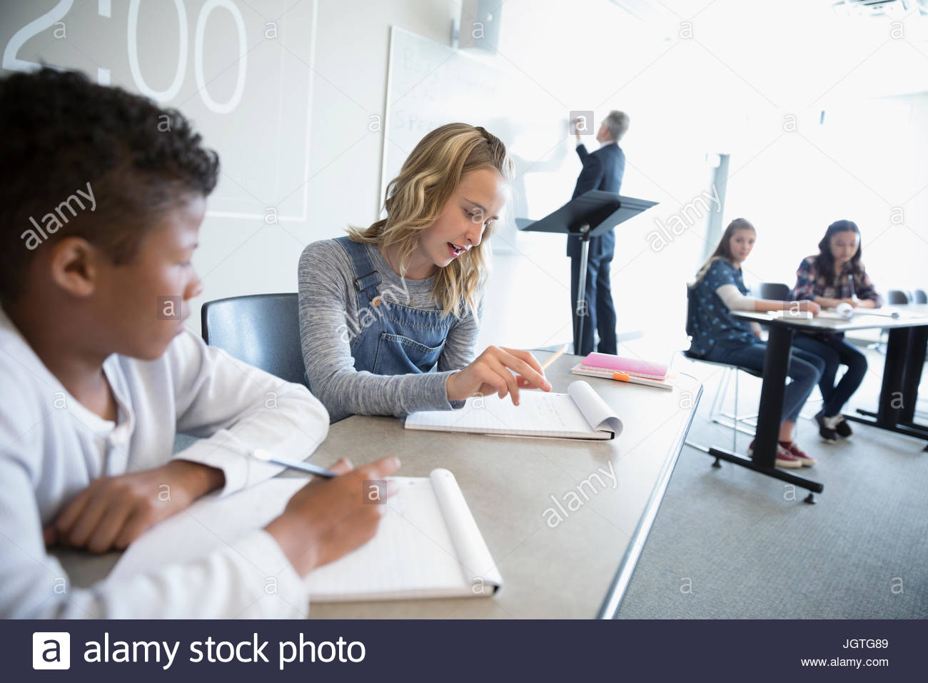 Two Students Talking In Class
