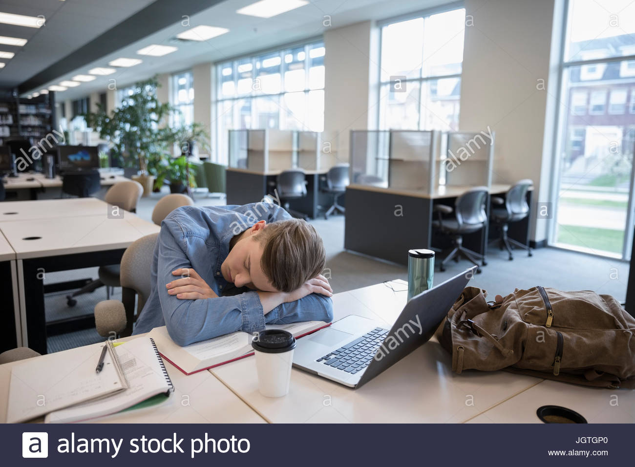 Tired student library hi-res stock photography and images - Alamy