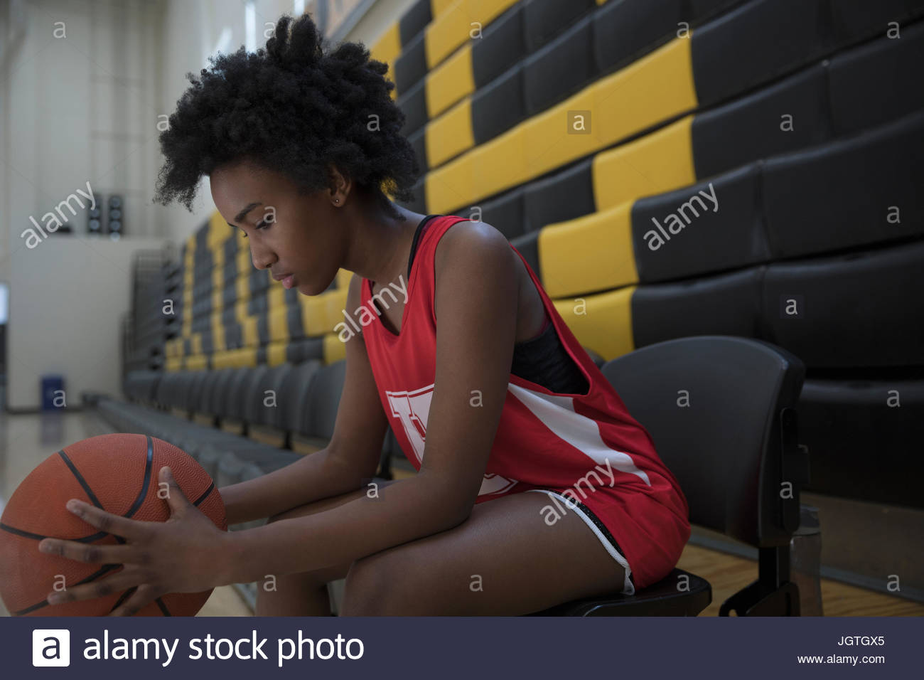 Female athlete sitting on bench hi-res stock photography and images - Alamy